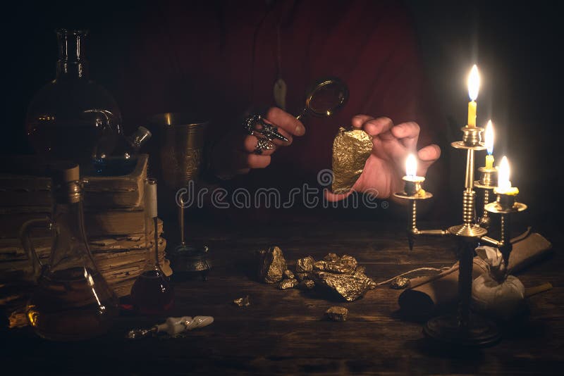 Alchemist. stock image. Image of scroll, holding, nugget - 139258017