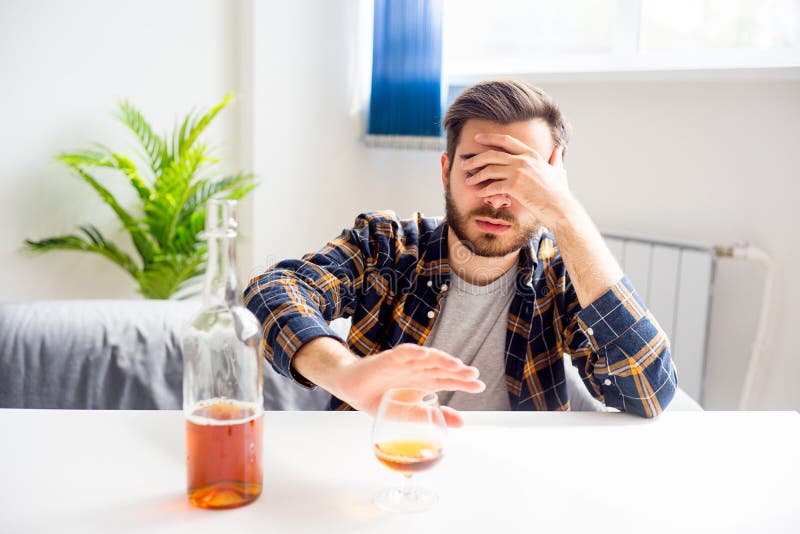 Alcohol addicted man stock photo. Image of depressed - 99755122