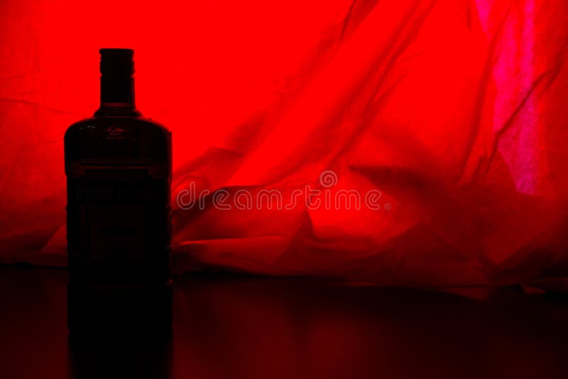 Alcohol Bottle on Red Backround Stock Image - Image of winery, drink ...