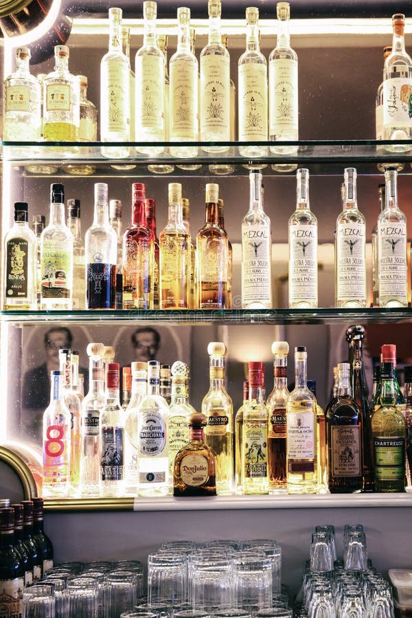 Alcohol bottles in a bar editorial stock photo. Image of vintage - 36566398