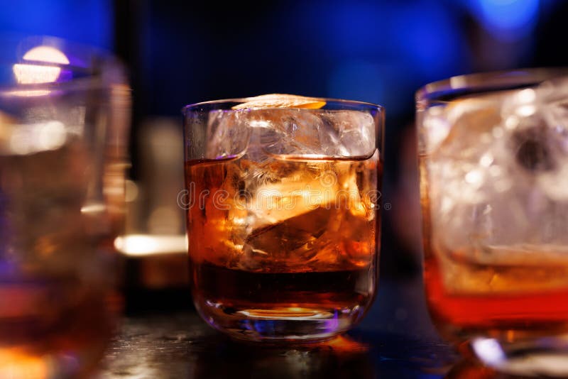 Alcohol Cocktail Drink on the Table, Whiskey and Rum Coctail on the Bar ...