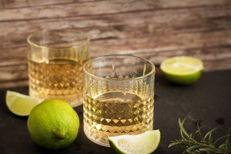 Alcohol Drink in Glass with Lime Stock Photo - Image of lemon, slice ...