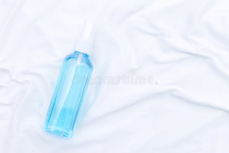 Alcohol Spray in Plastic Bottle on White Fabric Background Stock Image ...