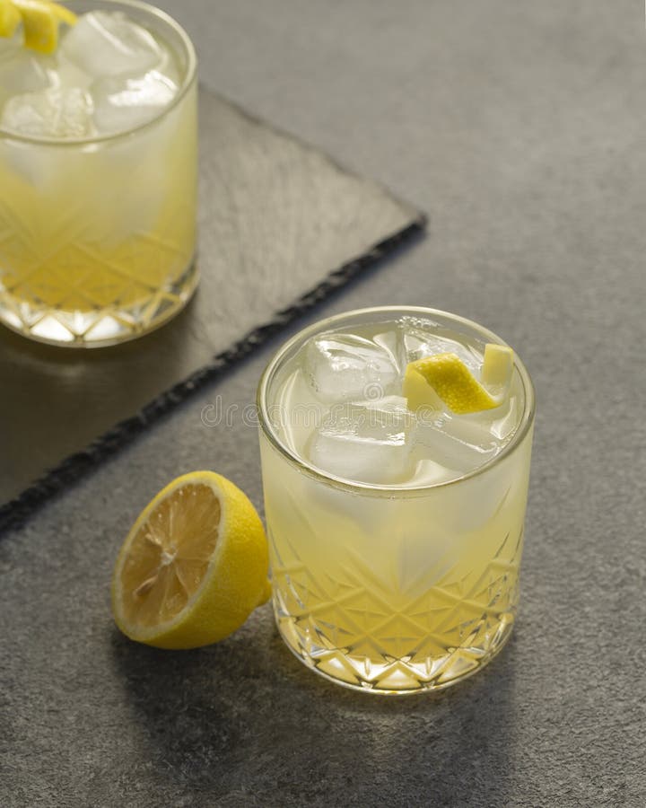Alcoholic Drink Gin Tonic Cocktail with Lemon and Ice on Black Stone ...