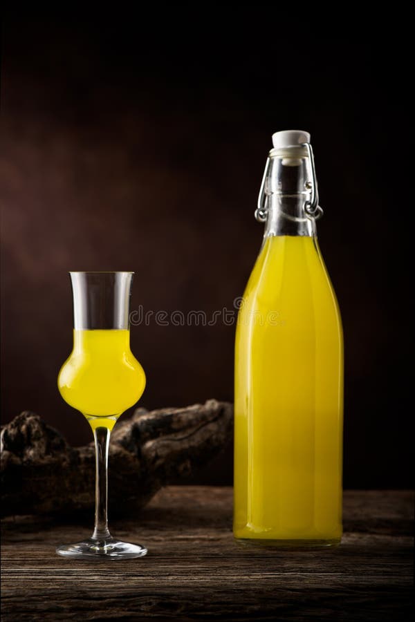 Alcoholic Drink Yellow Limoncello in a Bottle on a Dark Background ...