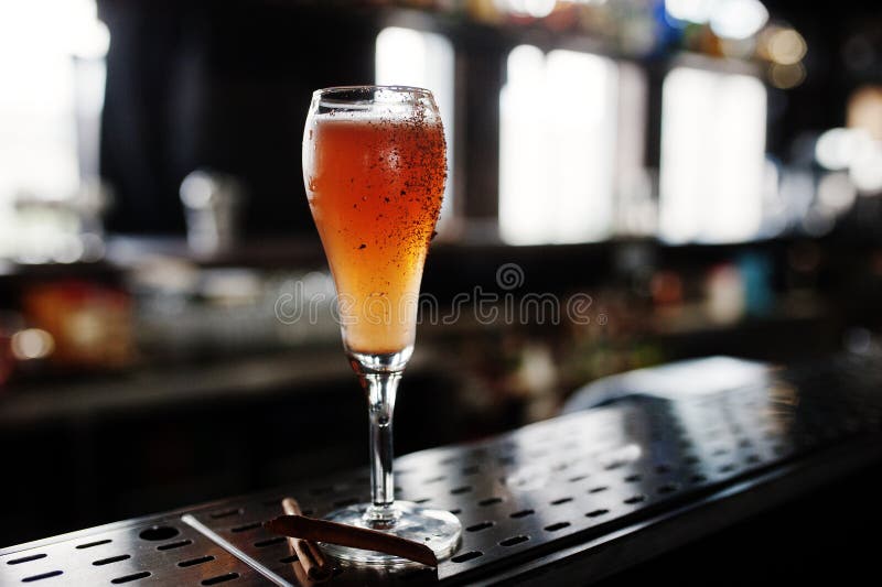 Alcoholic Long Cocktail with Cinnamon at Bar Table. Stock Image - Image ...