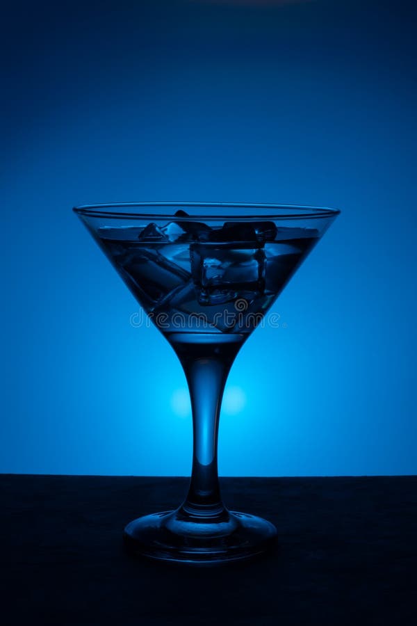 Alcoholic or Non-alcoholic Cocktail with Ice Cubes, on a Blue Gradient ...