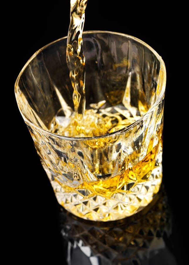 Alcoholic Spirit Being Poured Stock Image - Image of golden, alcoholic ...