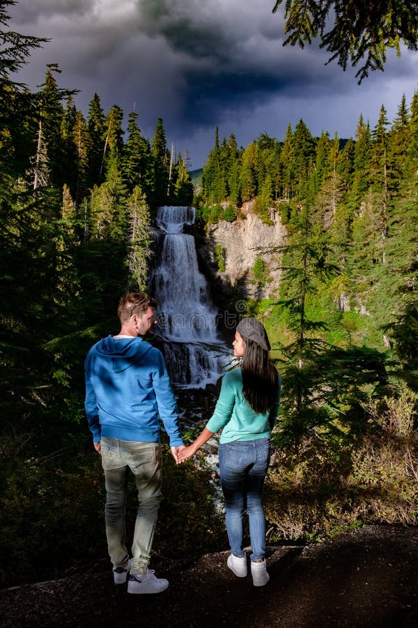Alexander Falls, BC, Canada, Couple Watching Waterfall in Canada Stock ...