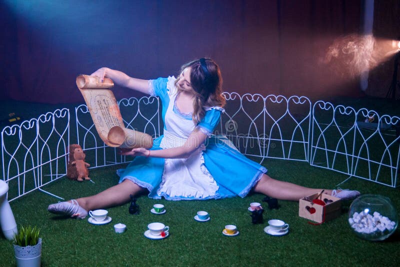 Alice is Considering a Scroll with a Map Stock Photo - Image of ...