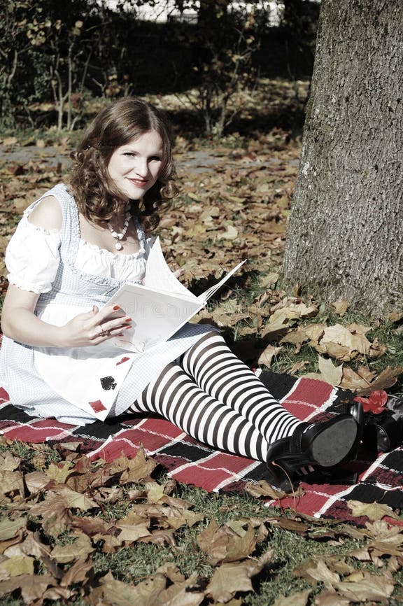 Alice reading a book stock image. Image of vintage, beautiful - 23050193