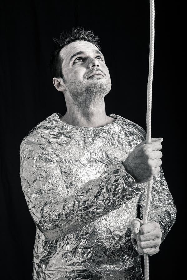 Alien Man with Rope Looking Up Stock Photo - Image of discovering ...