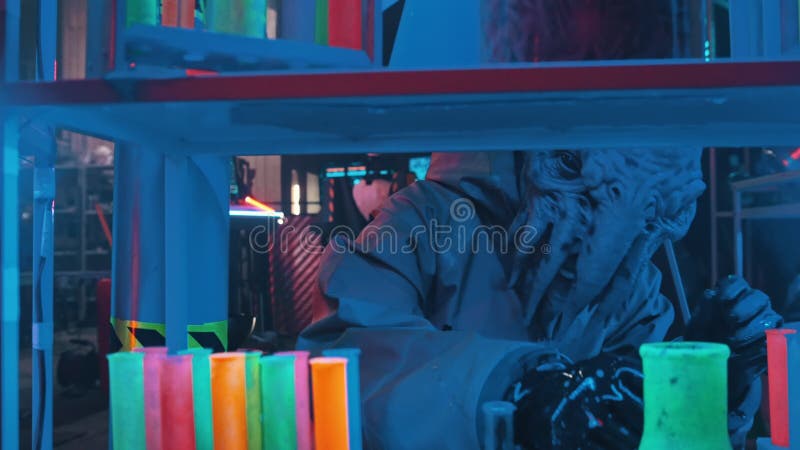 An Alien with Tentacles in the Lower Face Looking Around in the Secret ...