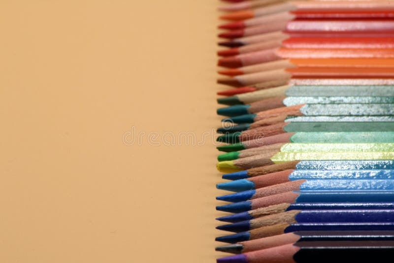 Aligned colored pencils stock photo. Image of glass - 209730348