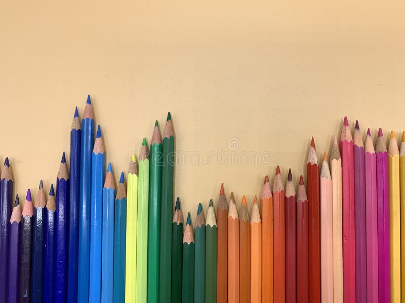 Aligned colored pencils stock photo. Image of light - 209730350