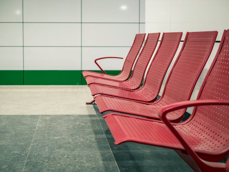 Aligned Metal Red Chairs for Waiting in a Metro or Subway Station Stock ...