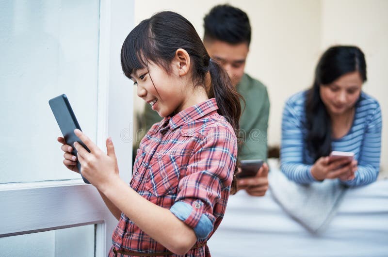 They All Enjoy the Wonders of Technology. a Family Using Digital ...