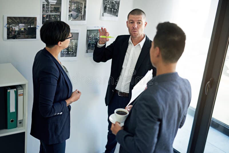 It All Starts with a Plan of Action. Three Colleagues Working in the ...