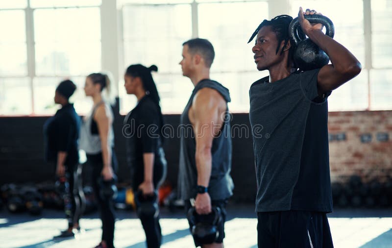 All Together at the Same Time. a Focused Group of Young People Standing ...