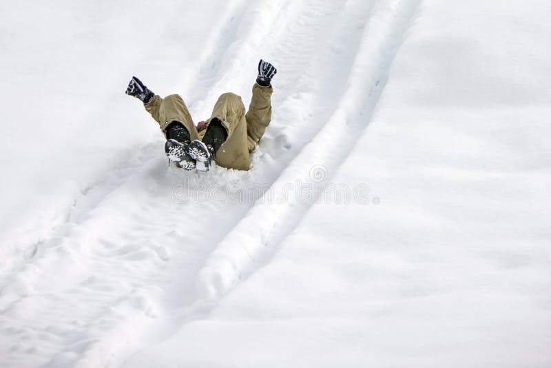 All in White, Sliding on Snow Stock Photo - Image of scenic, funny ...