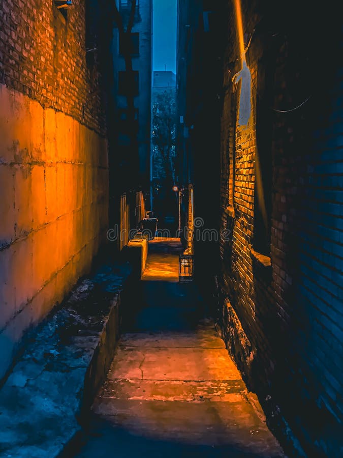 Alleyway in between Apartment Buildings, during Nightfall. Stock Photo ...