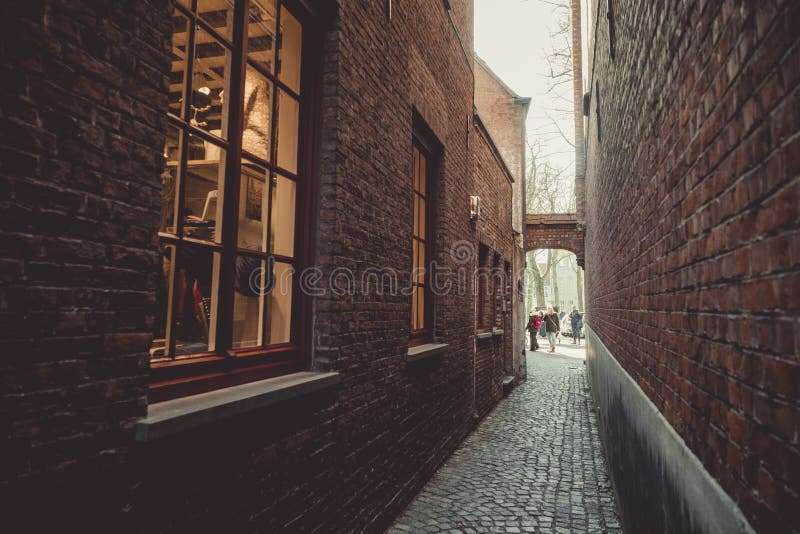 Alleyway with Glass Windows and a Brick Wall of a Building Stock Photo ...