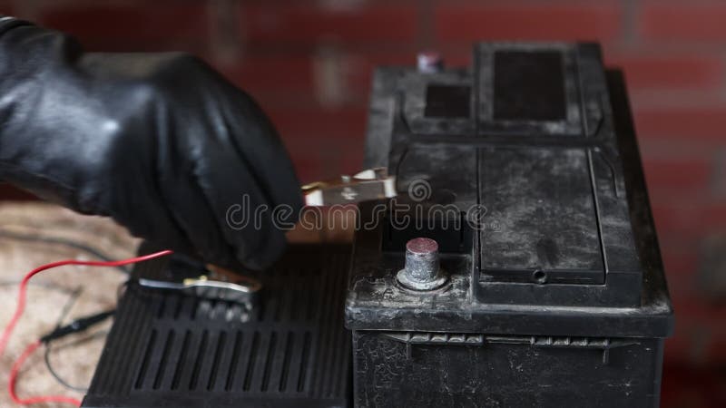 Alligator Clips of Charger are Connected To Car Battery. Stock Video ...