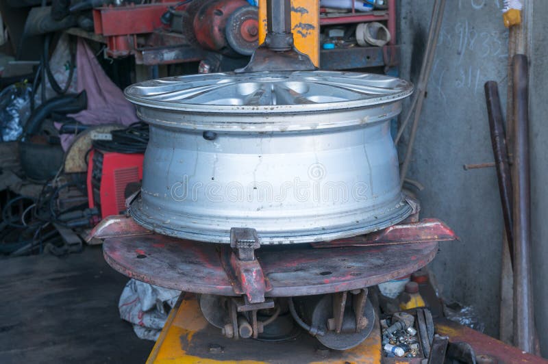 Alloy Wheel on Remove the Wheel Machine Stock Photo - Image of change ...