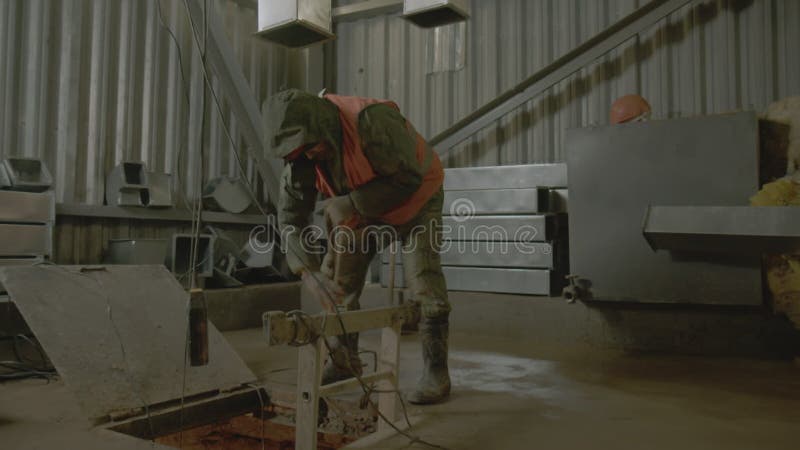 Construction Worker Pulls Bucket with Soil from Well in Shop Stock ...