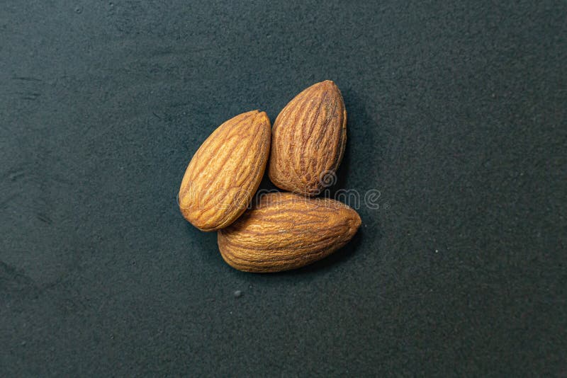 Almond on Black Ceramic Plate Close Up Image Stock Image - Image of ...