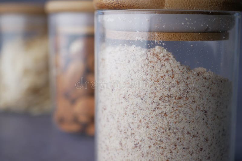 Almond Powder and Almond in a Jar on Table, Stock Photo - Image of ...