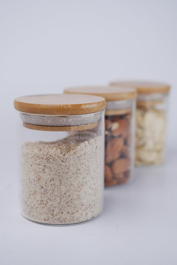 Almond Powder and Almond in a Jar on Table, Stock Photo - Image of ...