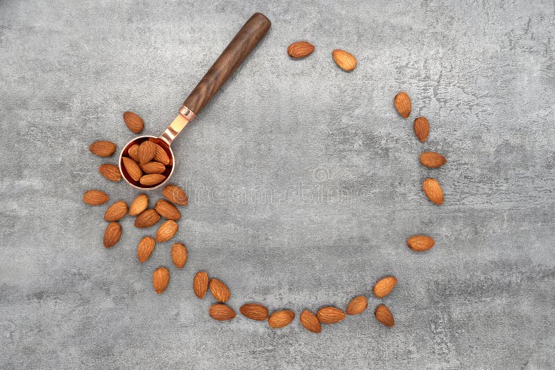 Almond in Spoon and Group of Almond Nuts on Stone Texture Background ...