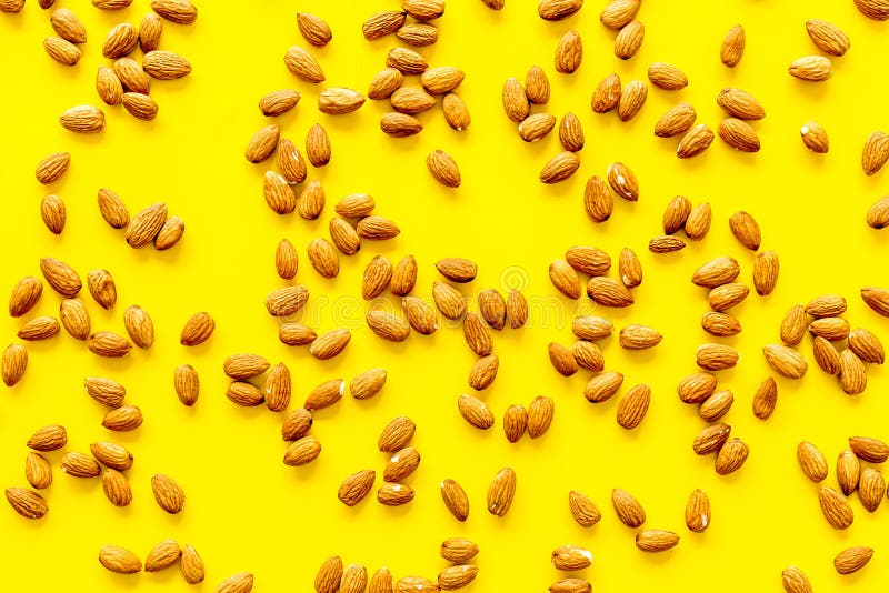 Almond on Yellow Background Top View Pattern Stock Image - Image of ...