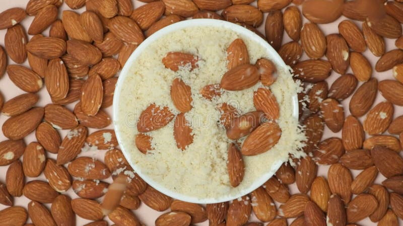 Almonds Falling in Almond Flour Top View Slow Motion. Stock Video ...