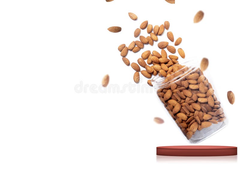 Almonds Falling from Glass Jar Isolated on White Background with Copy ...