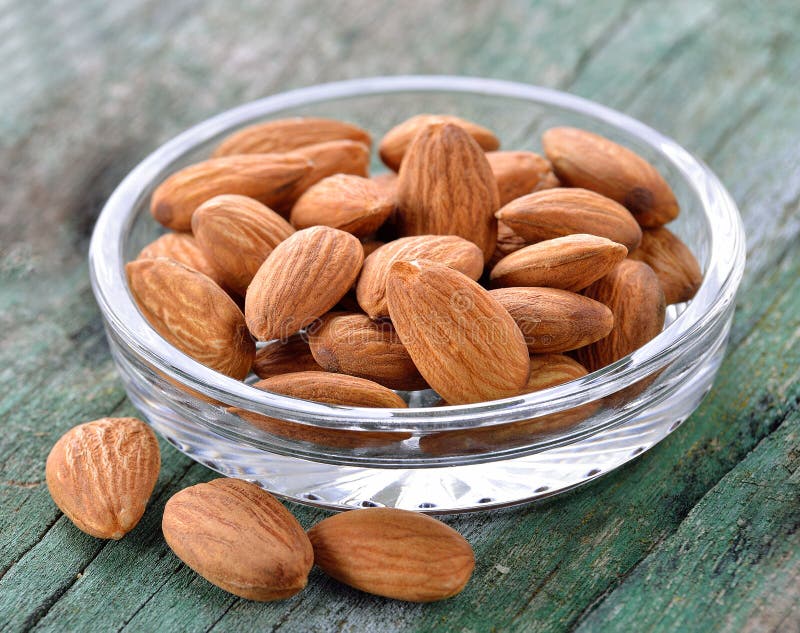 Almonds in glass bowl stock photo. Image of diet, organic - 61280974