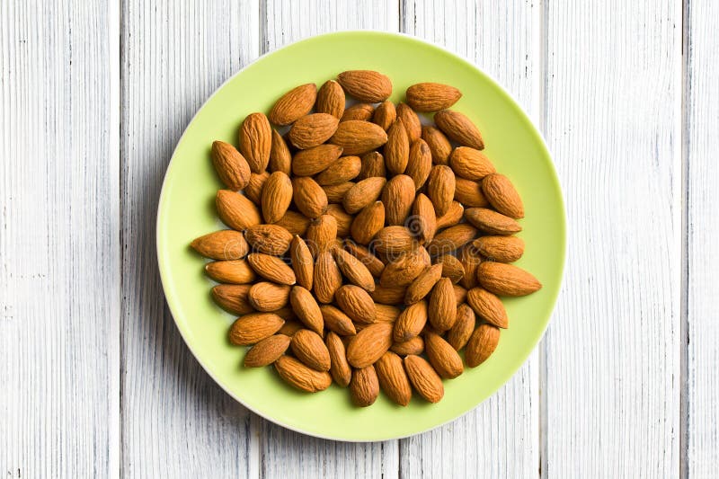Almonds on plate stock photo. Image of snack, natural - 31462640