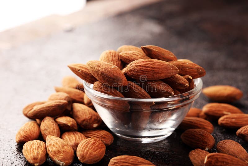 Almonds on a Rustic Background and Almond in Bowl Stock Photo - Image ...