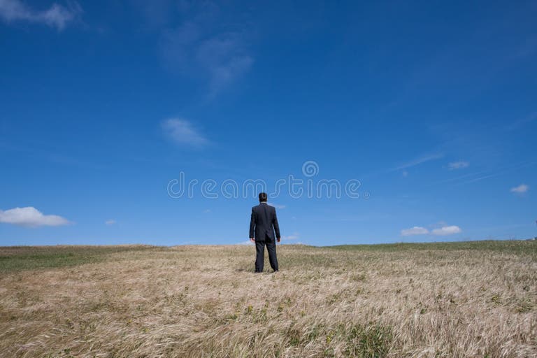 2,642 Man Standing Alone Field Stock Photos - Free & Royalty-Free Stock ...