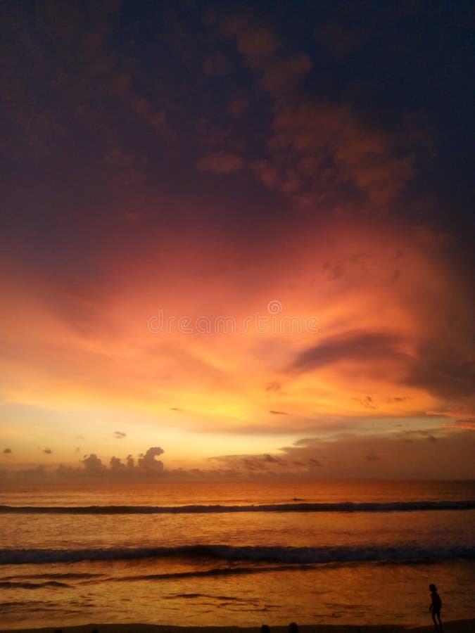 Alone in Kuta Bali Sunset stock image. Image of sunset - 262449541