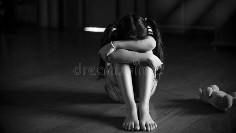 Alone Little Girl Siting in the Dark Room with Feel Sad Stock Image ...