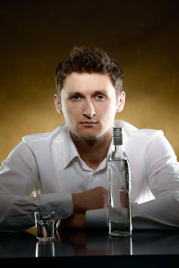Alone man drinking vodka stock photo. Image of alone - 31128440