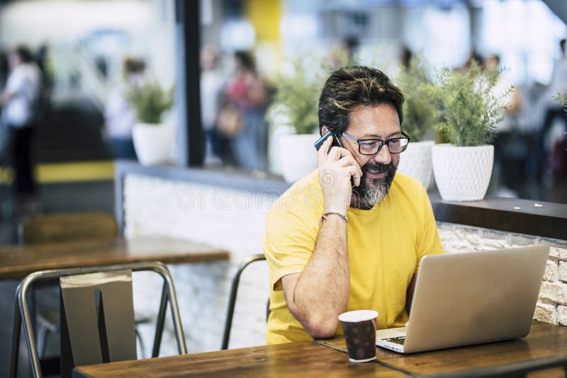 Alone Man at Wood Table Working in Her Workplace with His Laptop while ...