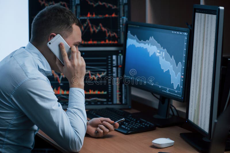 Alone in the Room. Man Working Online in the Office with Multiple ...