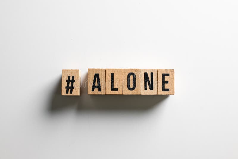 ` Alone ` Text Made of Wooden Cube on White Background Stock Photo ...