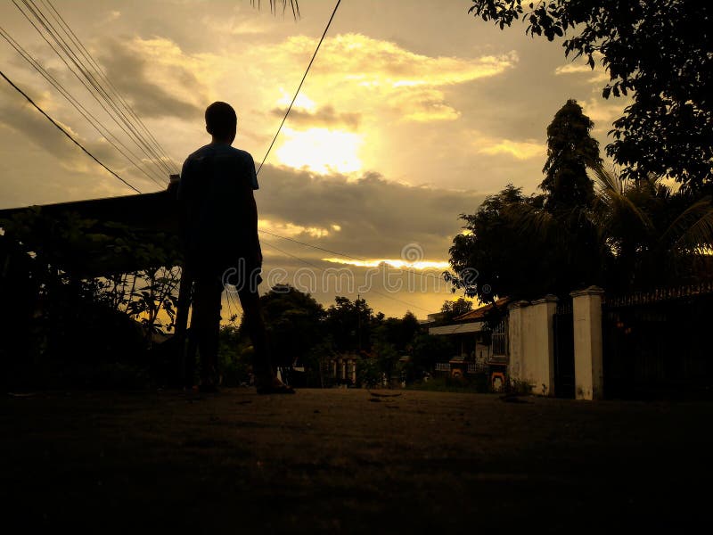 Alone to watch the sunset stock image. Image of sunset - 176010581