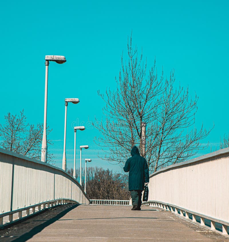 Alone walk on bridge stock photo. Image of blue, landmark - 263960380