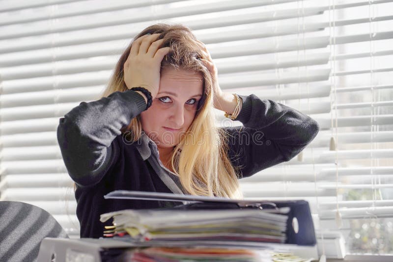 Alone Working in Office with a Lot of Documents. a Lot of Paper Work in ...