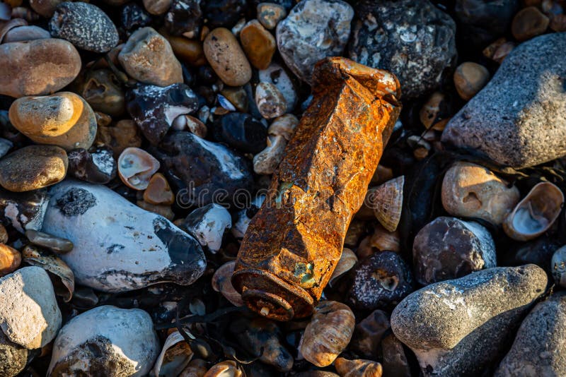 ALooking Down at a Rusty Can Washed Up on a Pebble Beach Stock Image ...